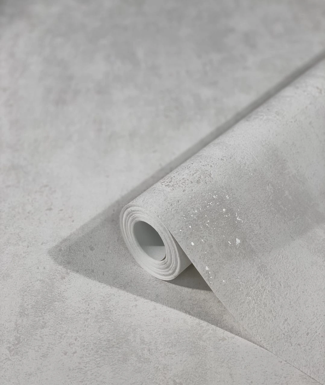 Non-woven wallpaper with light metallic effect in plain grey textured ...